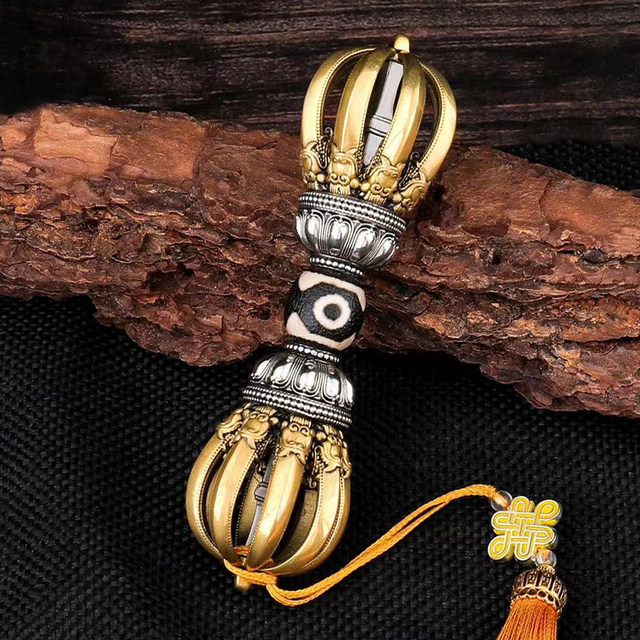 Tibetan nine -shaped carved diamond pestle hand holding the Nepalese ...