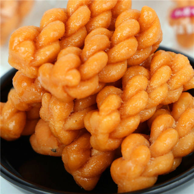 A box of small twist snacks in bags, independent small packages, pepper ...