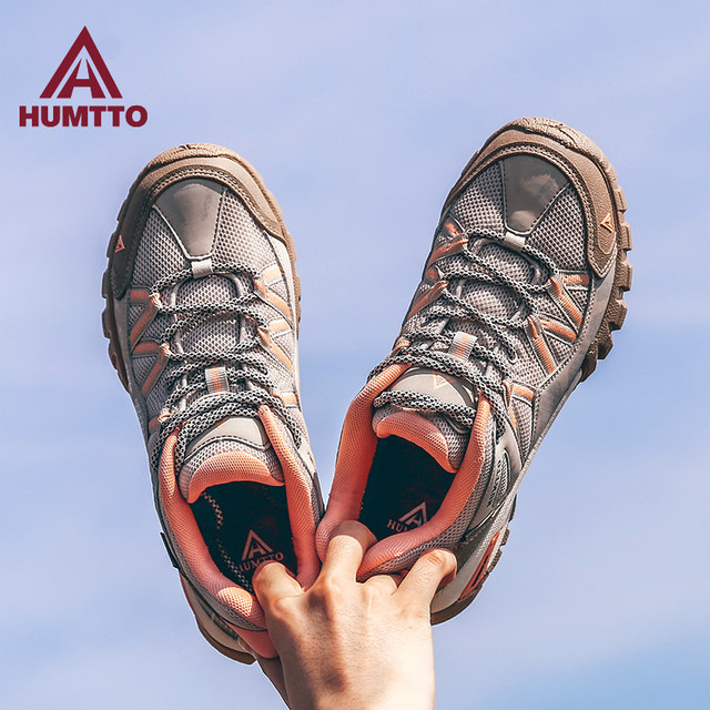 Tough outdoor mountaineering shoes women's water splashing water and ...