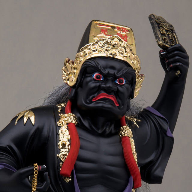 The ordinary resin black and white impermanent god statue in the ...