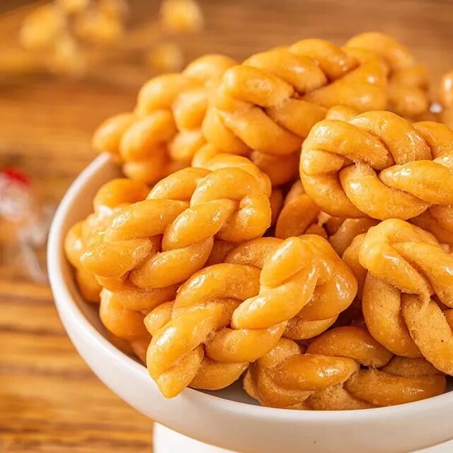 A box of small twist snacks in bags, independent small packages, pepper ...
