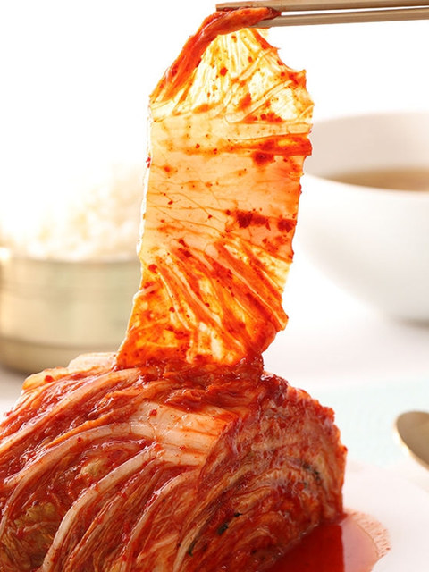 Three-bite, one-piece spicy cabbage kimchi, Korean-style rice pickles ...
