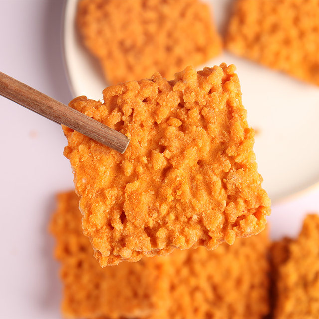 Crab-scented salted egg yolk glutinous rice crispy snacks in small ...