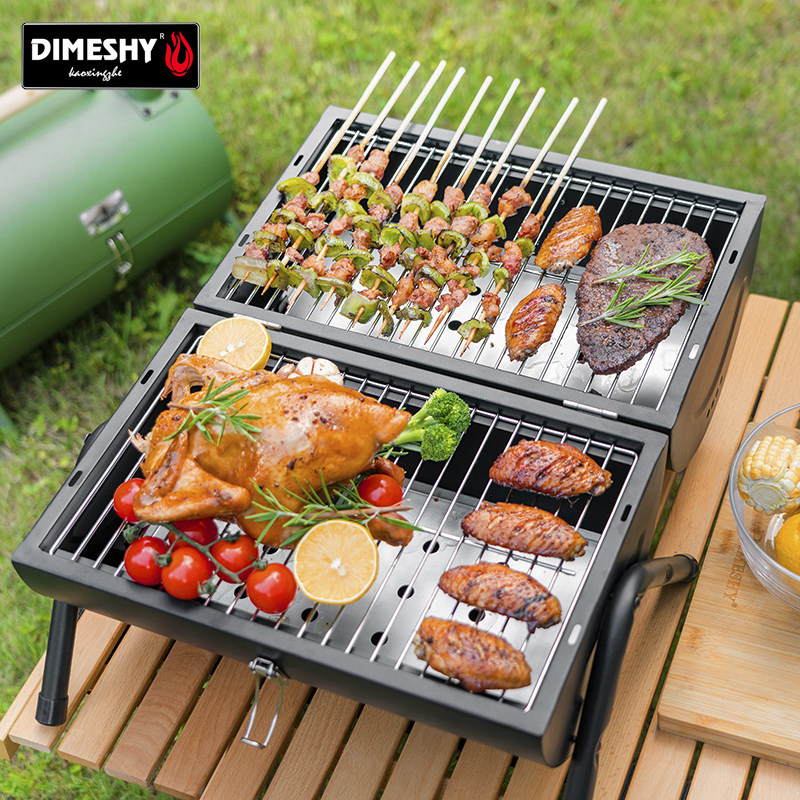 Tragbarer grill für picknicks und camping – holzkohleofen
