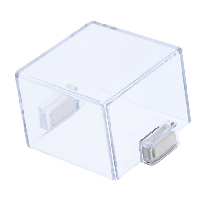 The magnetic emergency stop button protects the cover of the power ...