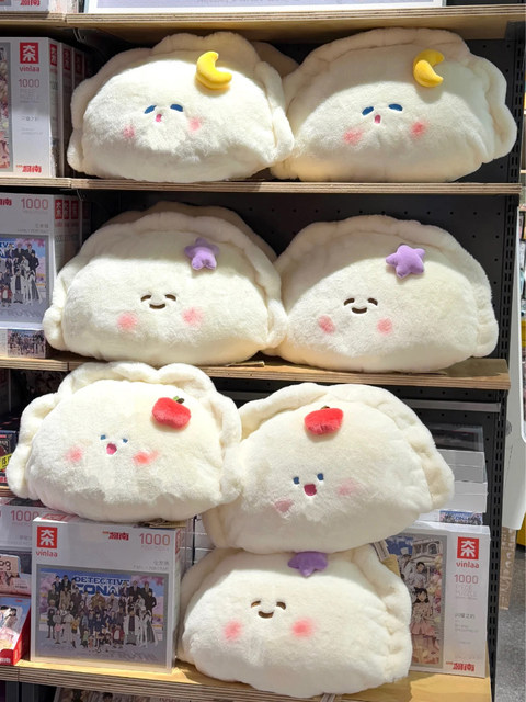 Cute dumpling doll sleeping pillow on the bed for girls, pillow doll ...