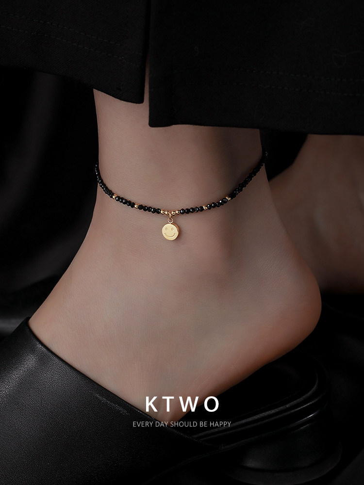 Ktwo Black Spinel Anklet - Smiling Face Design - Gold Plated