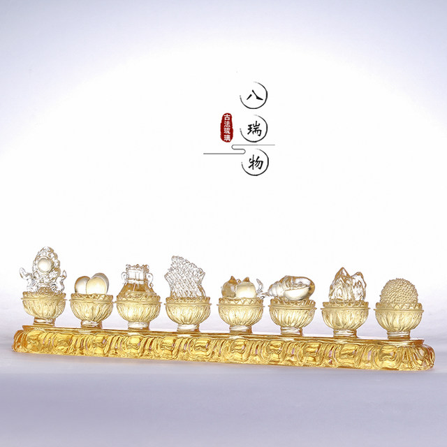 Ancient glazed eight auspicious objects ornaments in front of the ...