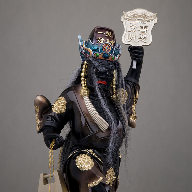The ordinary resin black and white impermanent god statue in the ...