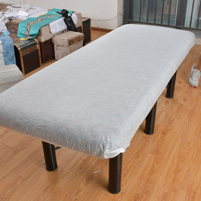 Disposable bedspread sheets dust-proof with holes in the corners and ...