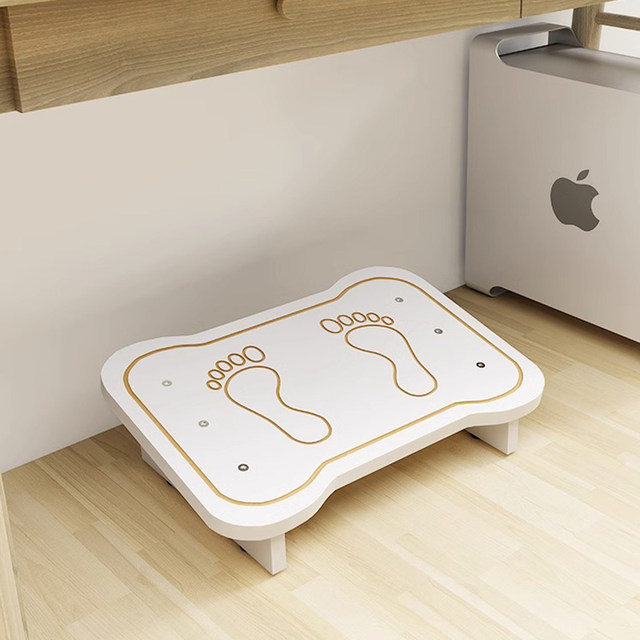 Office table under the foot artifact foot stool put the legs on the ...