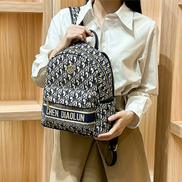 High-end large-capacity commuter genuine leather embroidered backpack ...