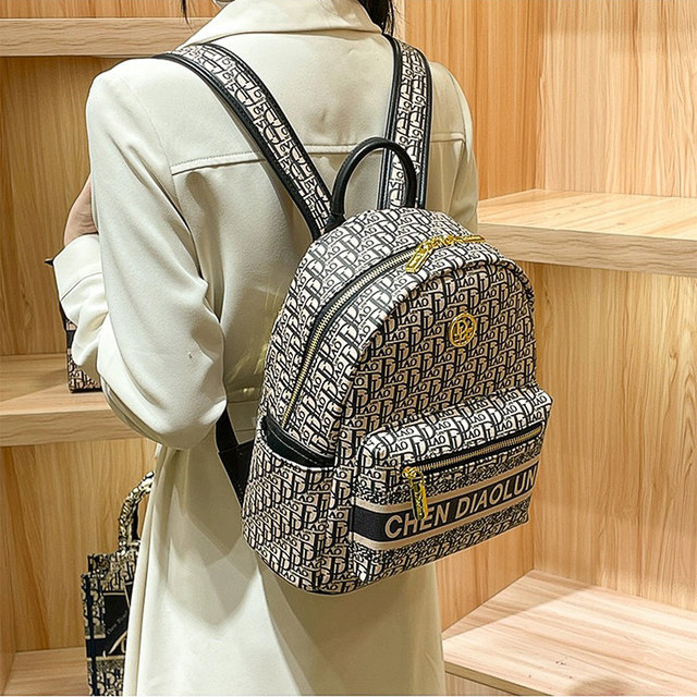 High-end large-capacity commuter genuine leather embroidered backpack ...