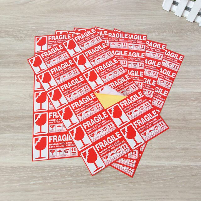 Chinese and English crushing carton label packaging courier warning ...