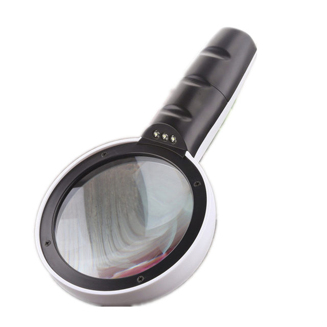 Magnifying glass outdoor field spotlight ignition with light to take ...