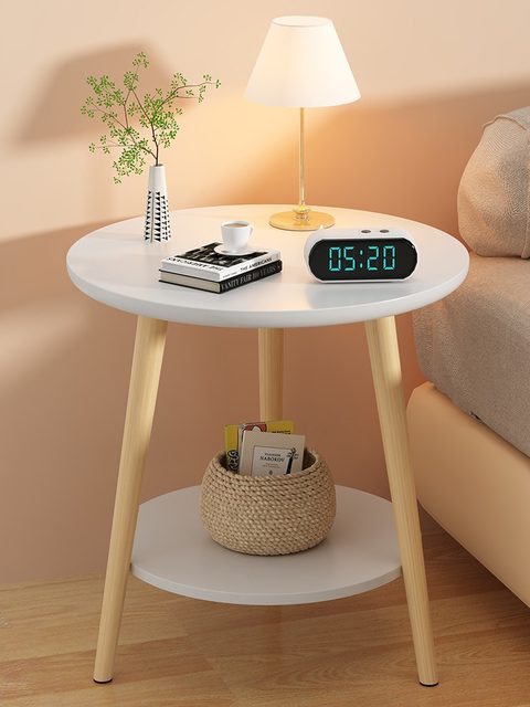 A few corners of the bedside table at the small round table, a few ...