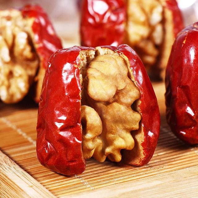 Red dates with walnut kernels, nuts, dried fruit snacks, snacks ...