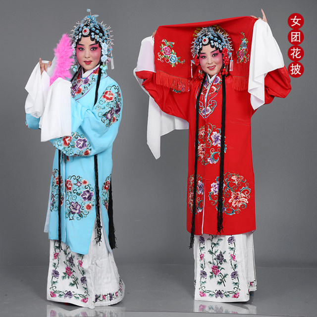 A costumed opera girl wears a Peking Opera troupe flower cape, a member ...