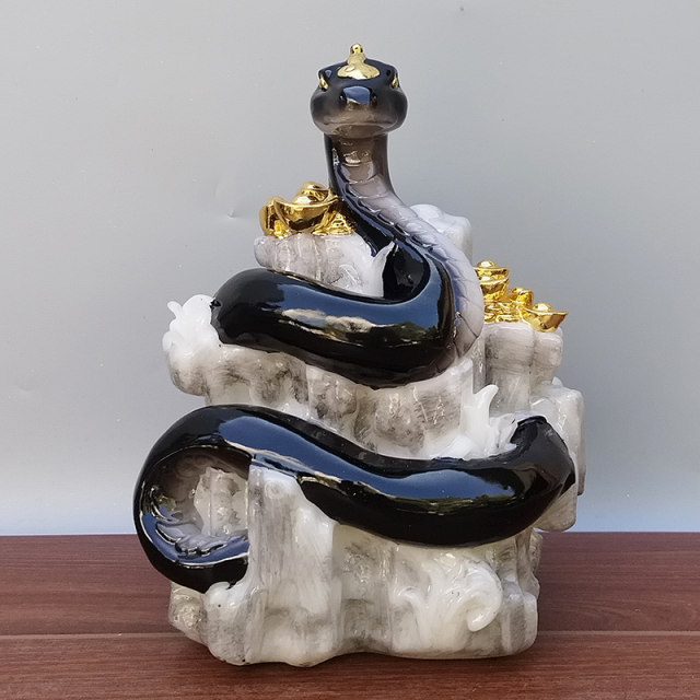 White marble black and white python real body sitting on the mountain ...