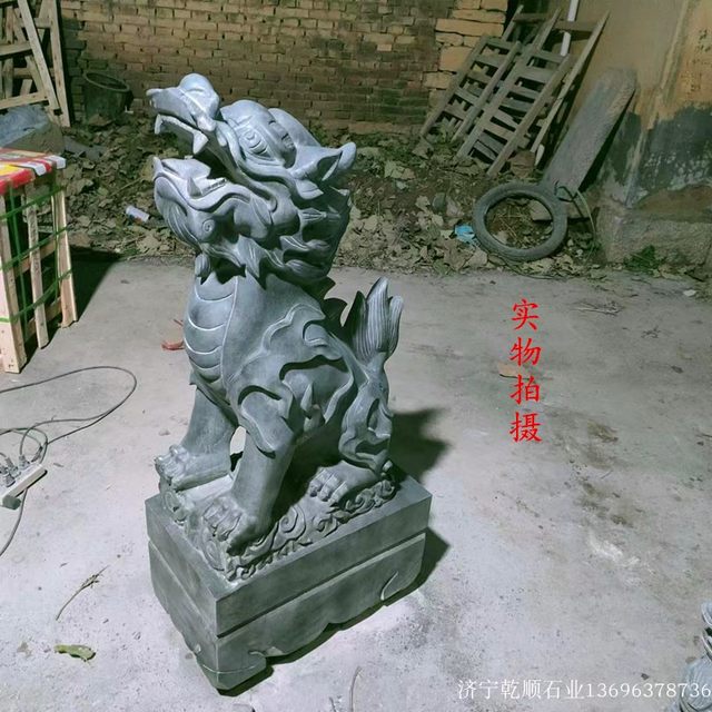 Stone carving bluestone looking at the sky and roaring mythical beast ...