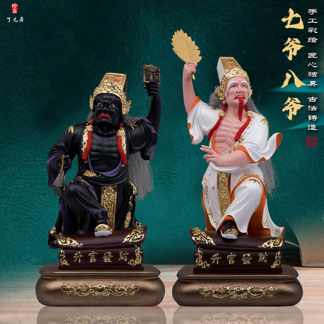 The ordinary resin black and white impermanent god statue in the ...