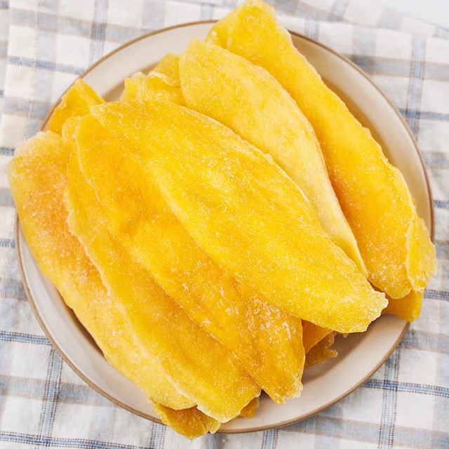 Fresh large slices of dried mango in bags, dried fruits, candied fruits ...