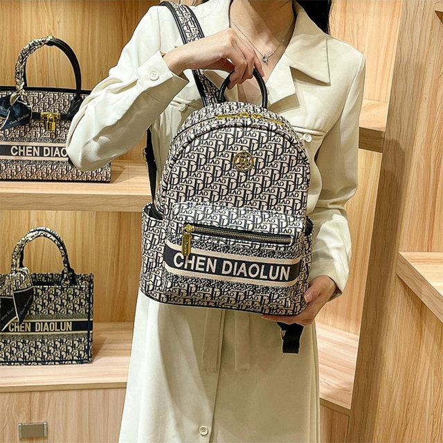 High-end large-capacity commuter genuine leather embroidered backpack ...