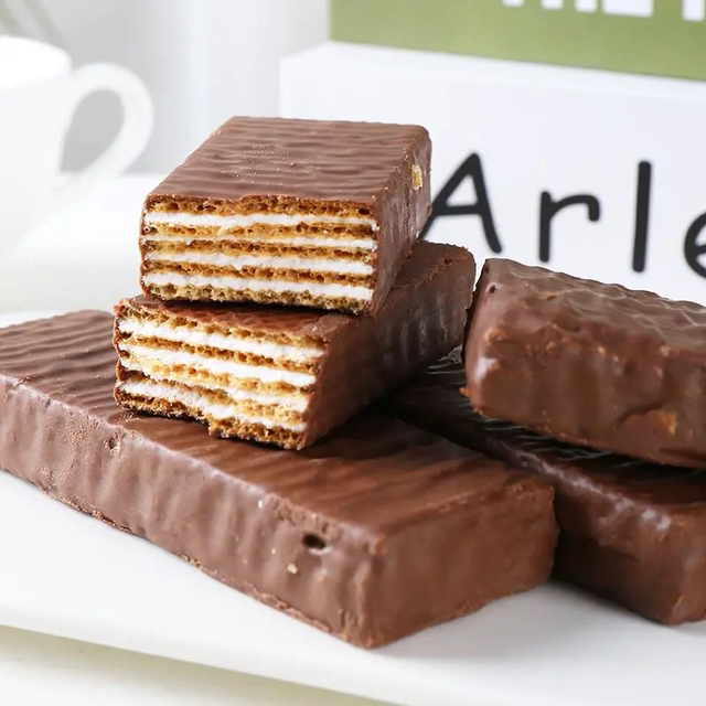 Chocolate wafer biscuit coating sandwich containing nuts and fruit ...