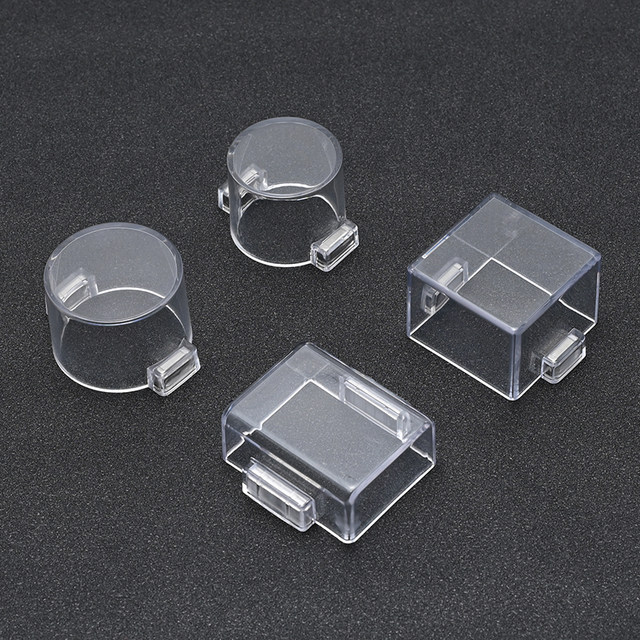 The magnetic emergency stop button protects the cover of the power ...