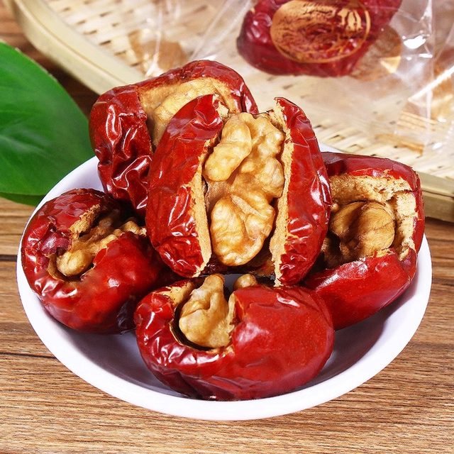 Red dates with walnut kernels, nuts, dried fruit snacks, snacks ...