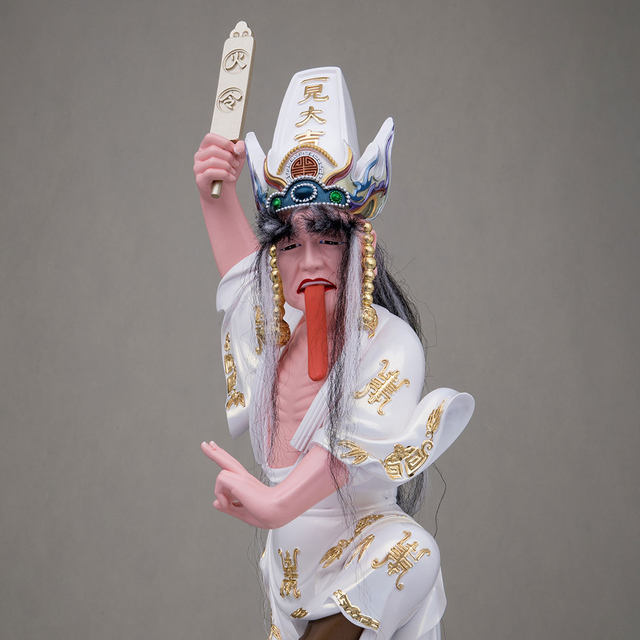 The ordinary resin black and white impermanent god statue in the ...