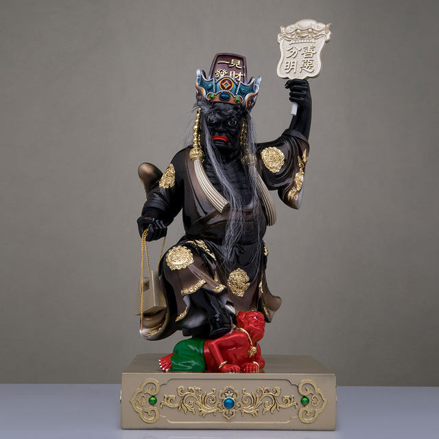 The ordinary resin black and white impermanent god statue in the ...