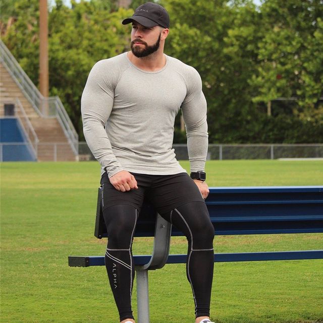 Solid color long-sleeved sports T-shirt, curved hem, round neck, slim fit bottoming shirt ...