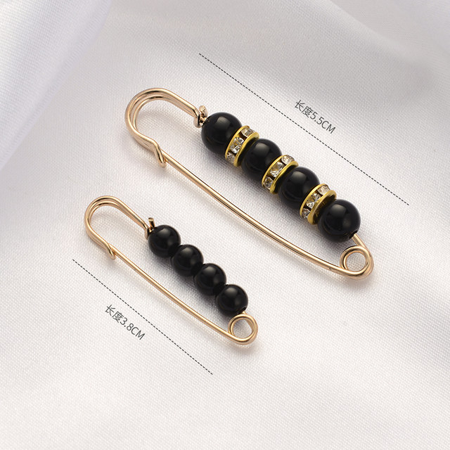 2 black waist pins