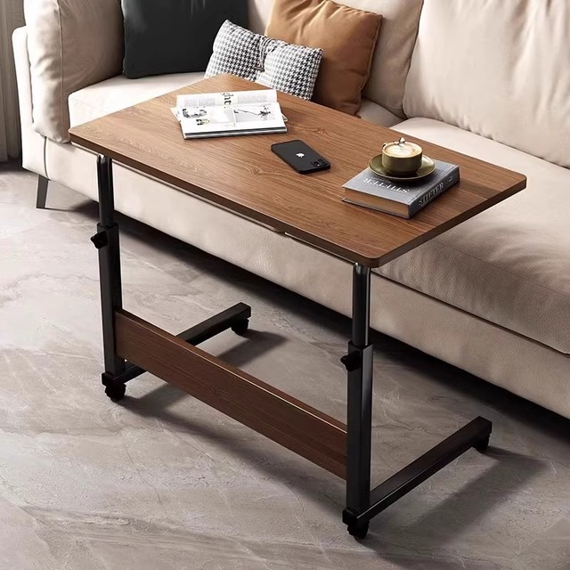 Moving a small table on the bedside table, a small table student ...