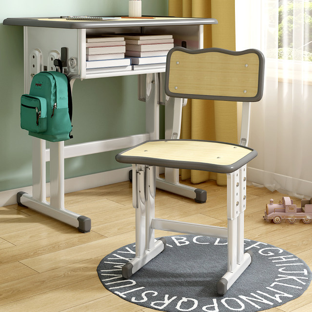 Thickened primary and secondary school students' desks and chairs cram ...