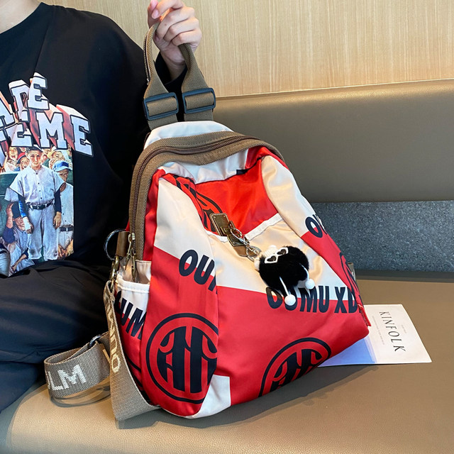 Good-looking red backpack with large capacity for travel, fashionable ...