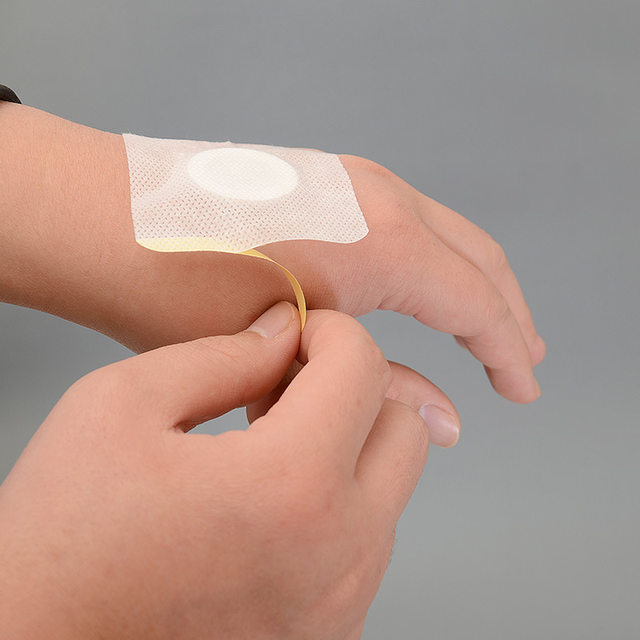 Non-woven hollow acupoint sticking breathable adhesive cloth navel ...