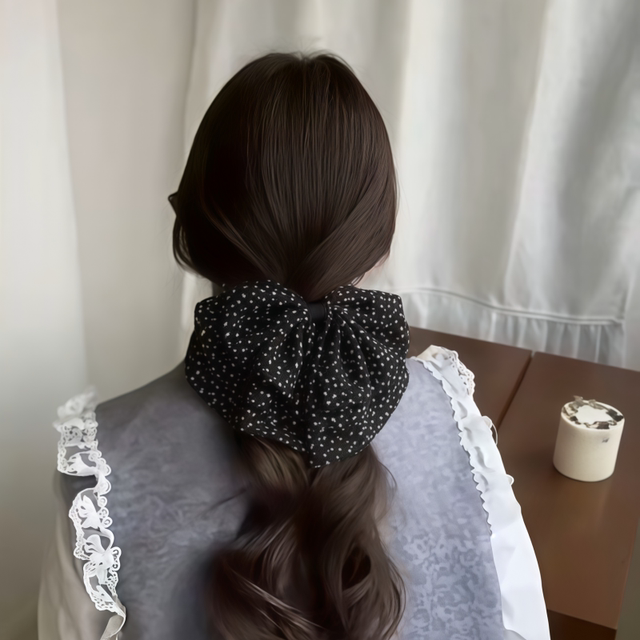 French black polka dot bow scratching small half-tied hair ponytail ...