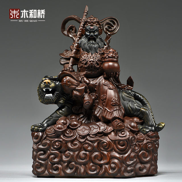 Painted wood carvings of the God of Wealth riding a tiger and Zhao ...