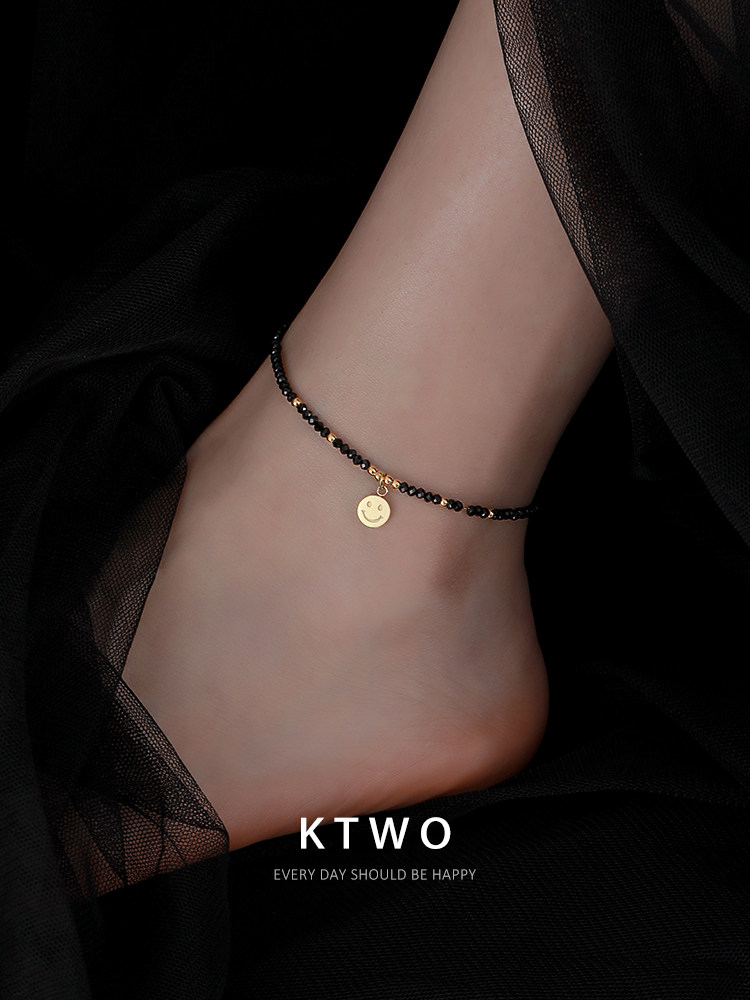 Ktwo Black Spinel Anklet - Smiling Face Design - Gold Plated
