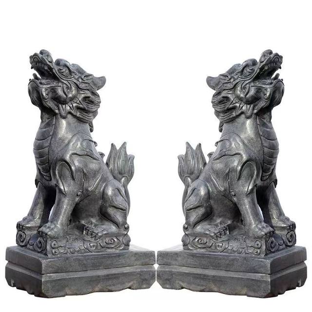 Stone carving bluestone looking at the sky and roaring mythical beast ...